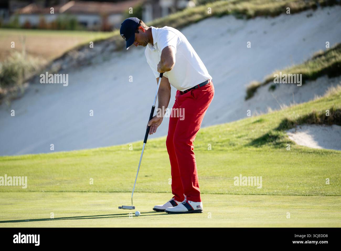 The USA team's Stewart Hagestad putts on the 12th hole during Walker ...