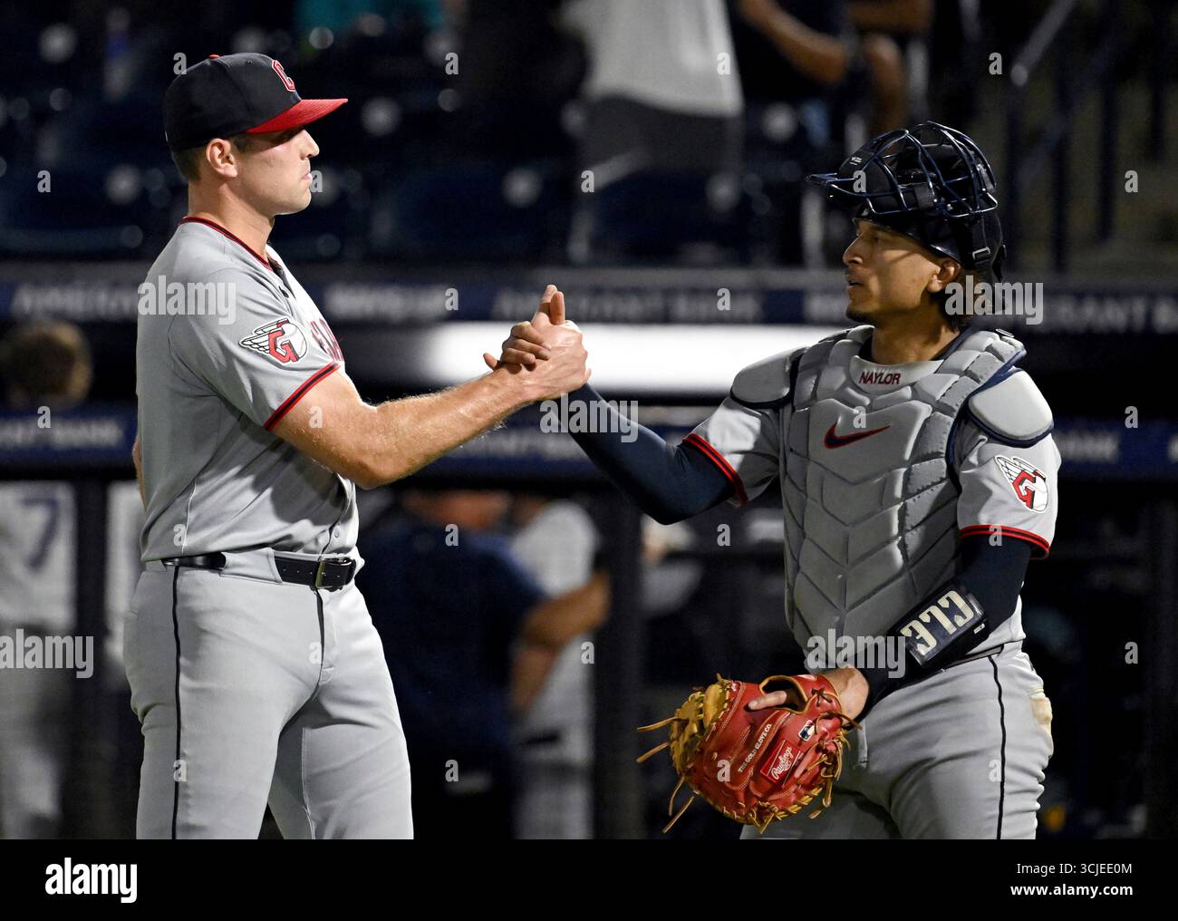 Cleveland Guardians pitcher Cade Smith, left, and catcher Bo Naylor ...