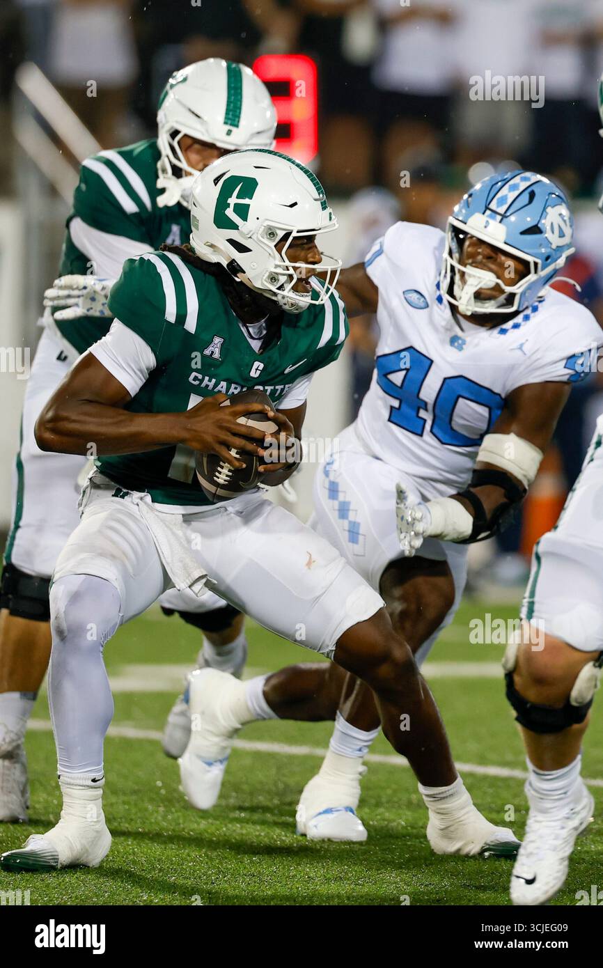 Charlotte quarterback Conner Harrell, left, tries to evade North ...