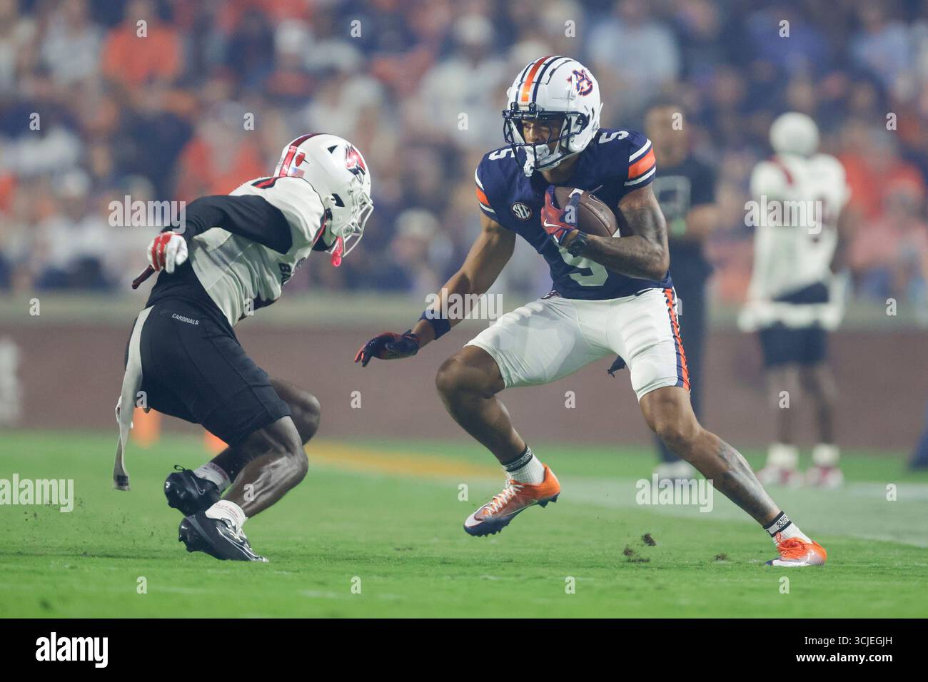 Auburn quarterback Deuce Knight (9) runs with the ball as Ball State ...