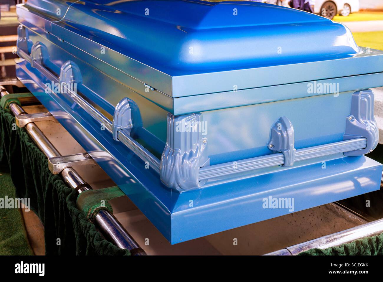 Blue casket is prominently placed at memorial cemetery during solemn ...