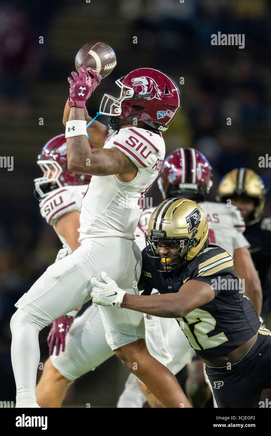 Purdue defensive back Ryan Turner (12) hits Southern Illinois running ...