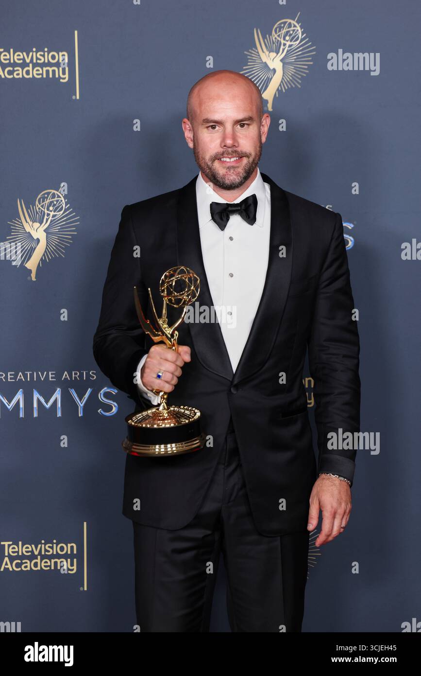 Adam Newport-Berra with their Emmy for Outstanding Cinematography for a Series (Half-Hour) for ...
