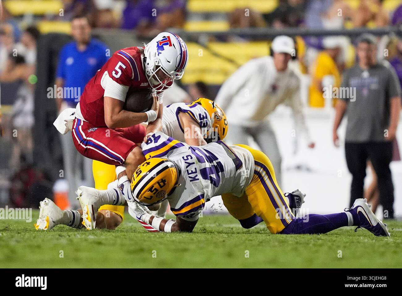 Louisiana Tech quarterback Blake Baker (5) is tackled by LSU ...