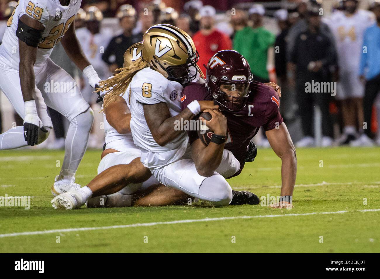 Virginia Tech quarterback Kyron Drones (1) is tackled by Vanderbilt ...