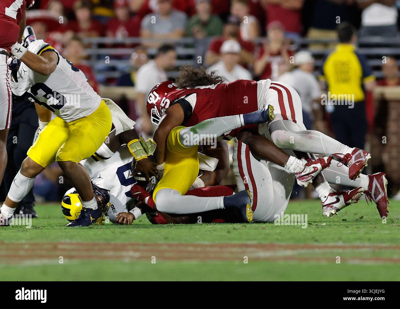 Oklahoma defensive lineman Jayden Jackson (65) sacks Michigan ...