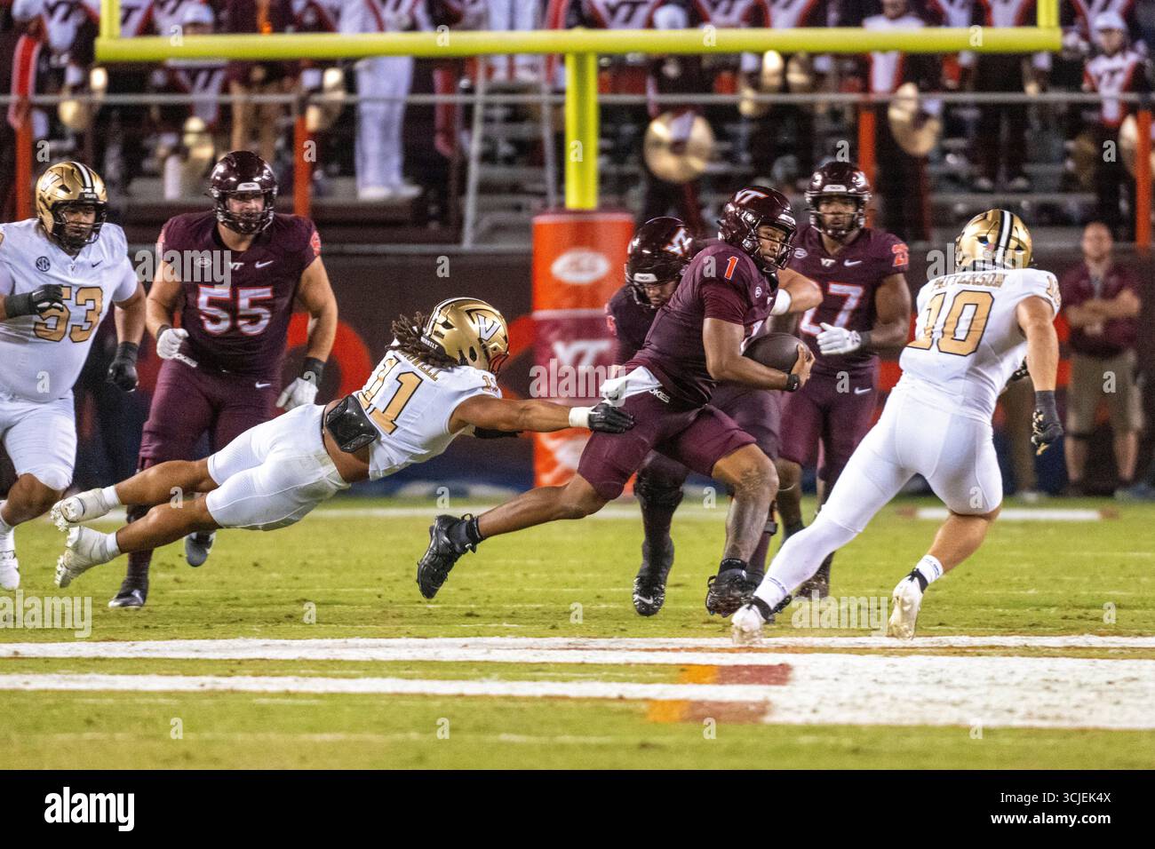Virginia Tech quarterback Kyron Drones (1) defended by Vanderbilt ...