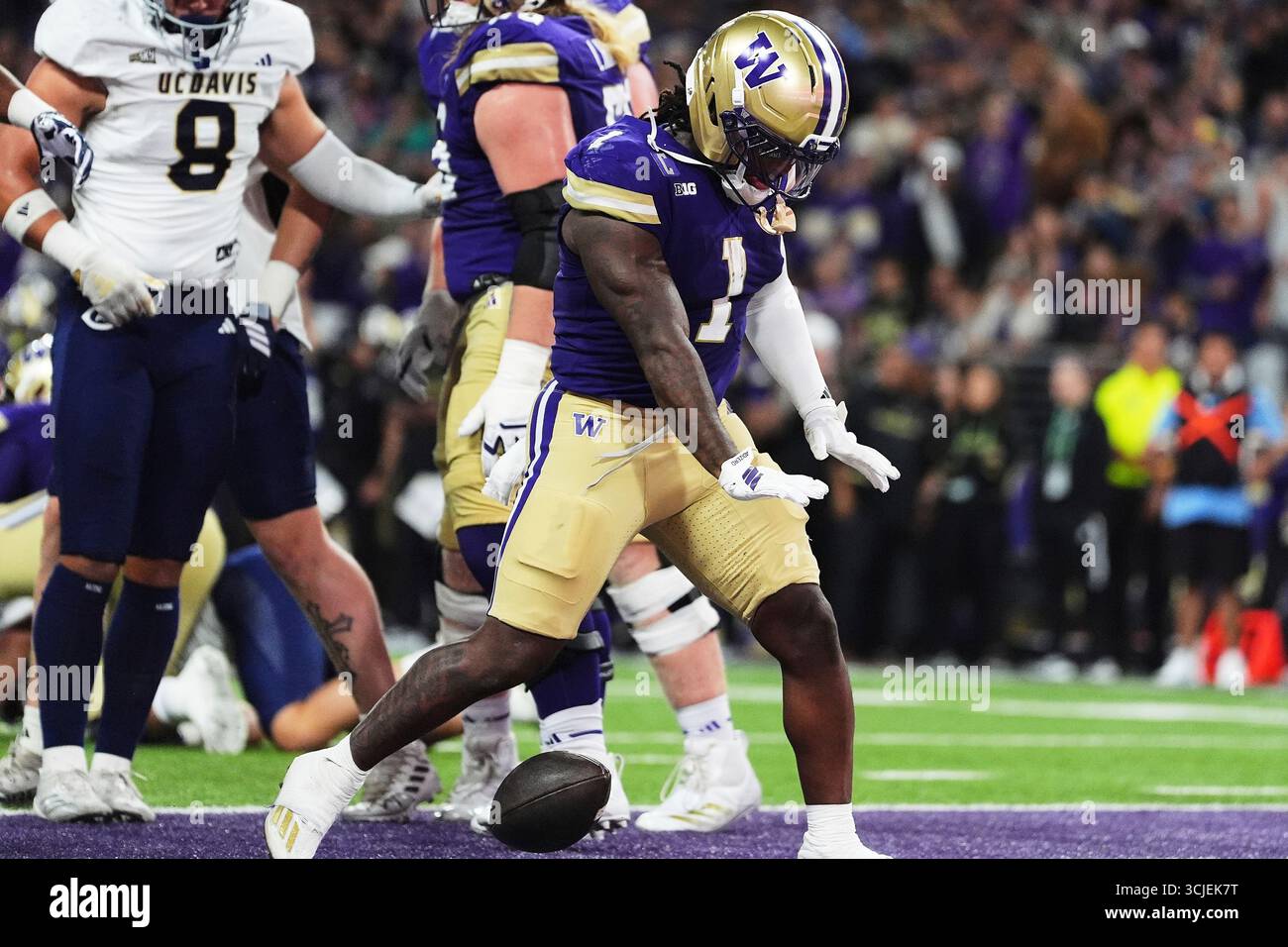 Washington running back Jonah Coleman (1) reacts after scoring his ...
