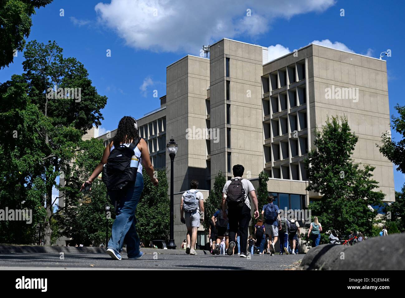 In this Sept. 3, 2025 photo, Students walk to Herter Hall that is home ...
