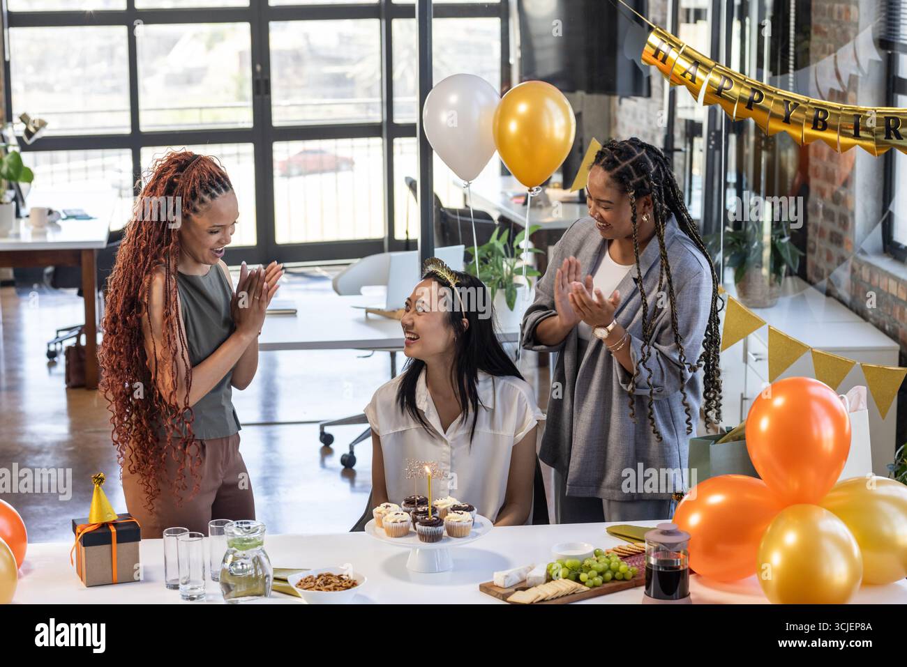Diverse coworkers celebrating cake hi-res stock photography and images ...