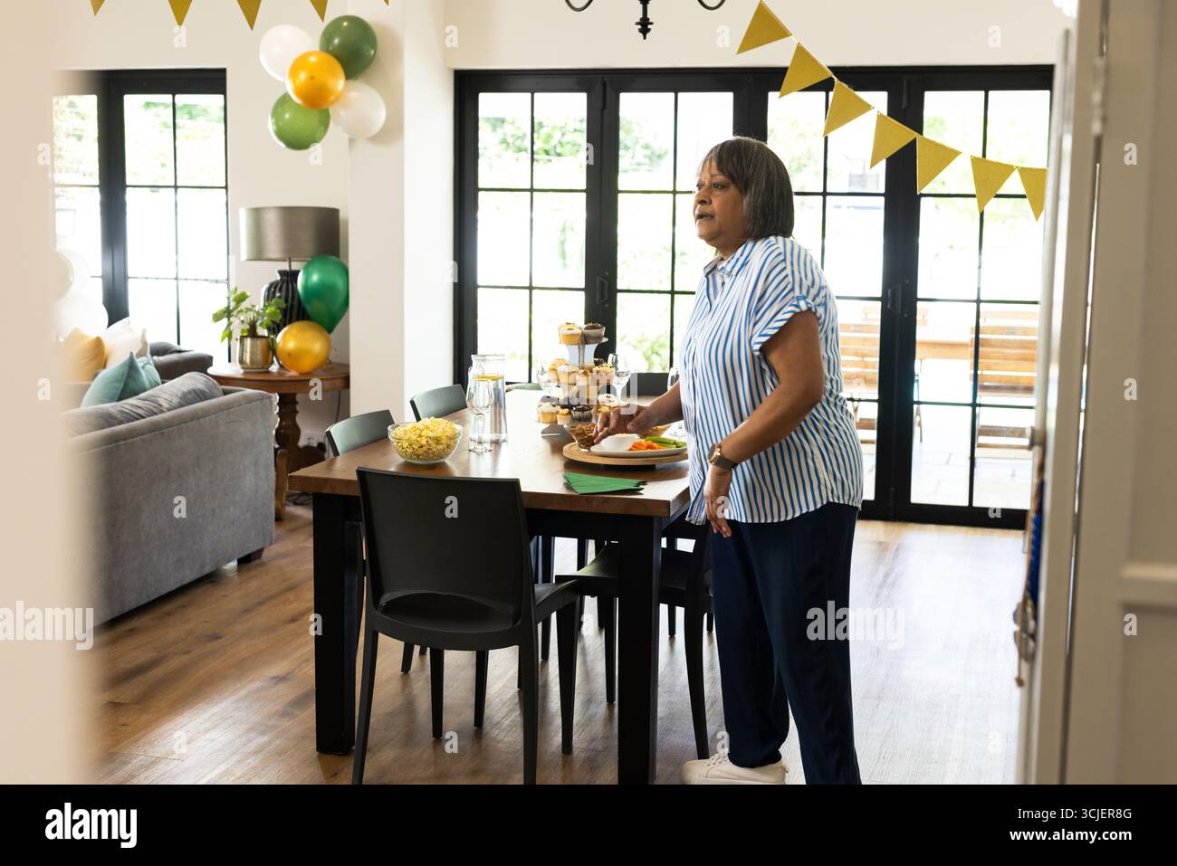 Friends preparing festive table hi-res stock photography and images - Alamy