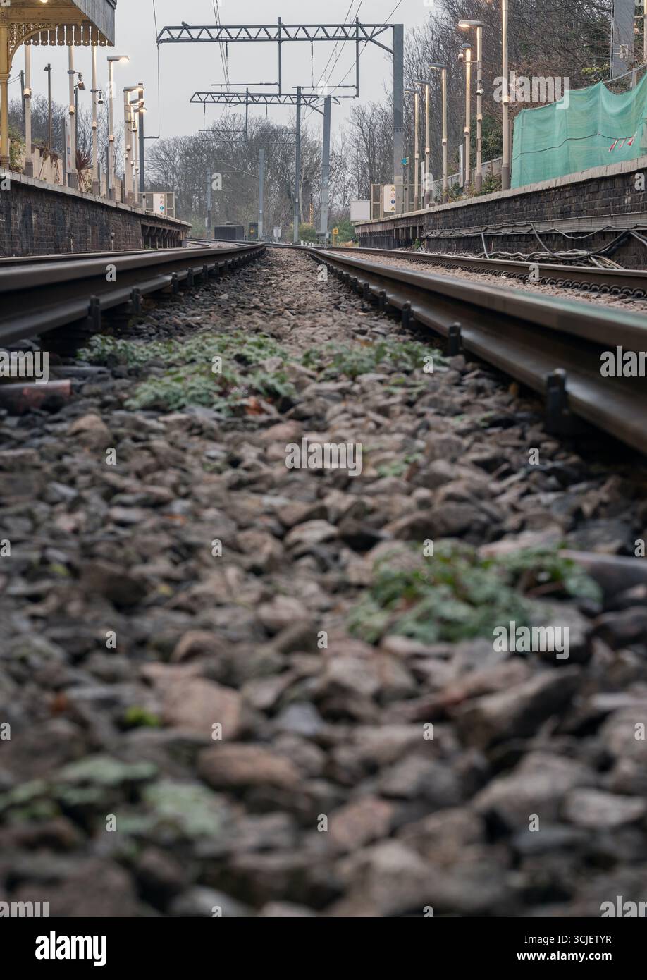 London, UK - Dec 25, 2023 - Railway iron rails from the low perspective ...