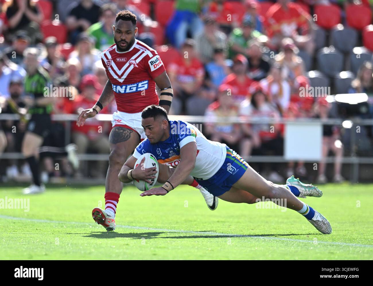 Michael Asomua of the Raiders scores a try during the NRL Round 27 ...
