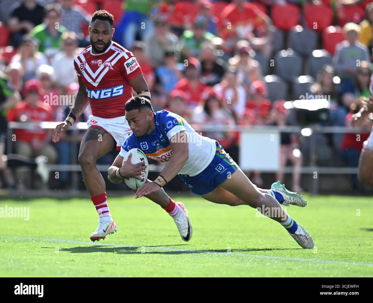 Michael Asomua of the Raiders scores a try during the NRL Round 27 ...