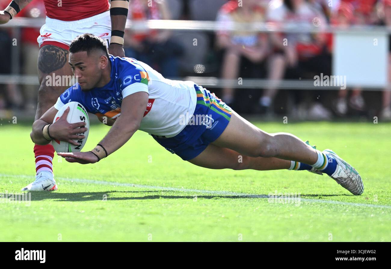 Michael Asomua of the Raiders scores a try during the NRL Round 27 ...