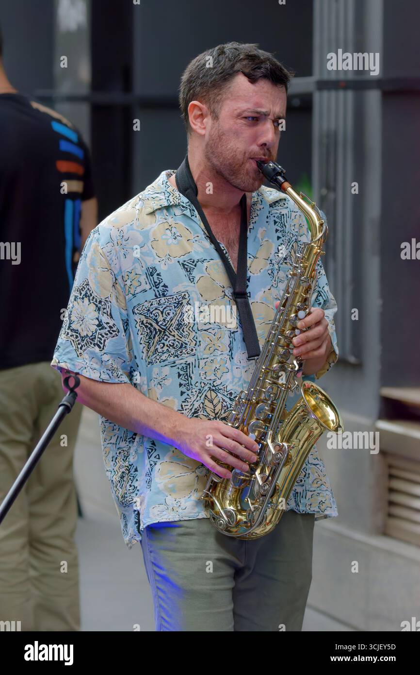 Young street singer saxophone hi-res stock photography and images - Alamy