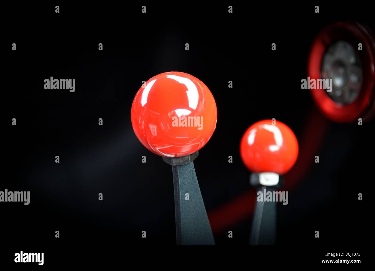 Red shifter knobs in a car at a car show Stock Photo - Alamy