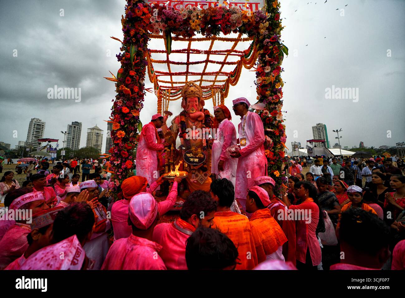 Indian Hindu devotees process with idols of the elephant-headed god ...
