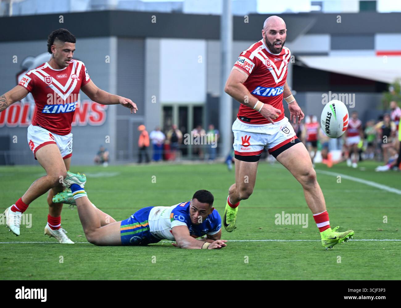 Mark Nicholls (right) of the Dolphins in action during the NRL Round 27 ...