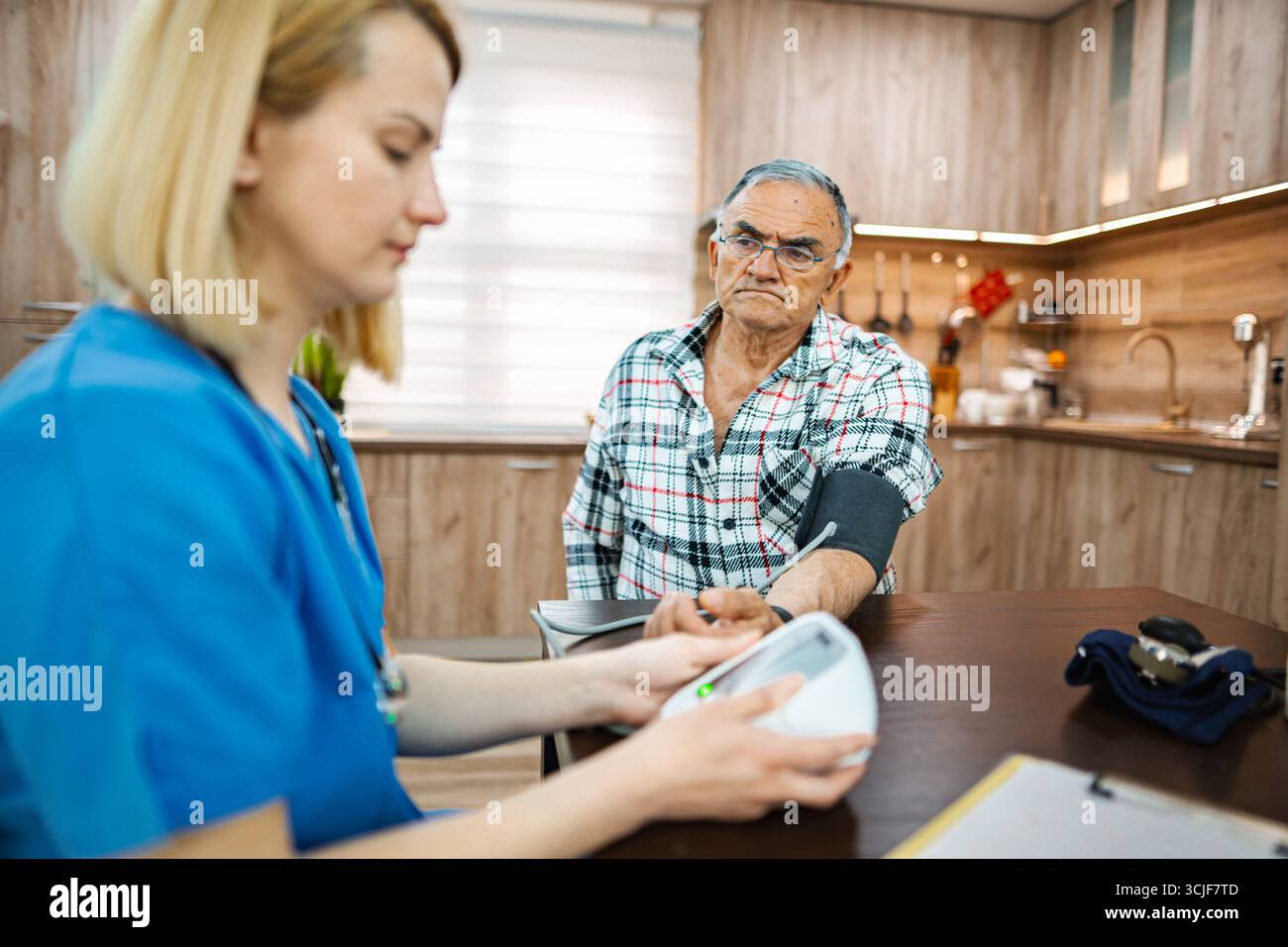 Assessment blood pressure elderly hi-res stock photography and images ...