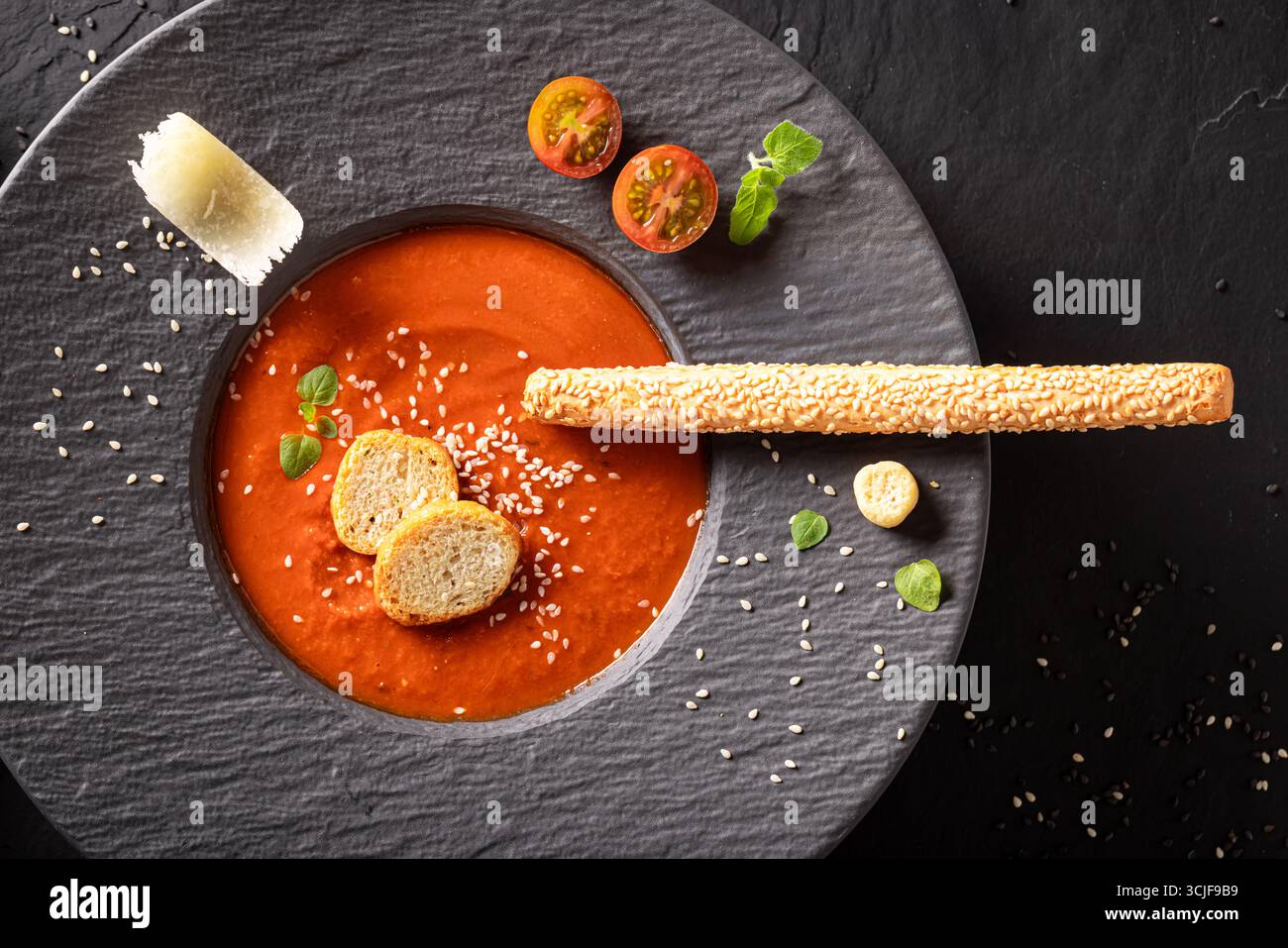 Refined tomato soup as culinary artistry on plate. Tomato soup as ...