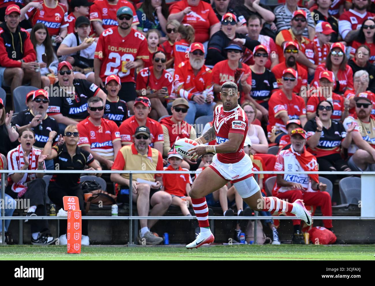 Jamayne Isaako of the Dolphins makes a break during the NRL Round 27 ...
