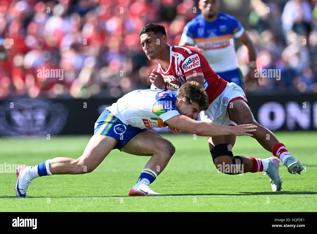 Tevita Naufahu of the Dolphins is tackled by Chevy Stewart of the ...