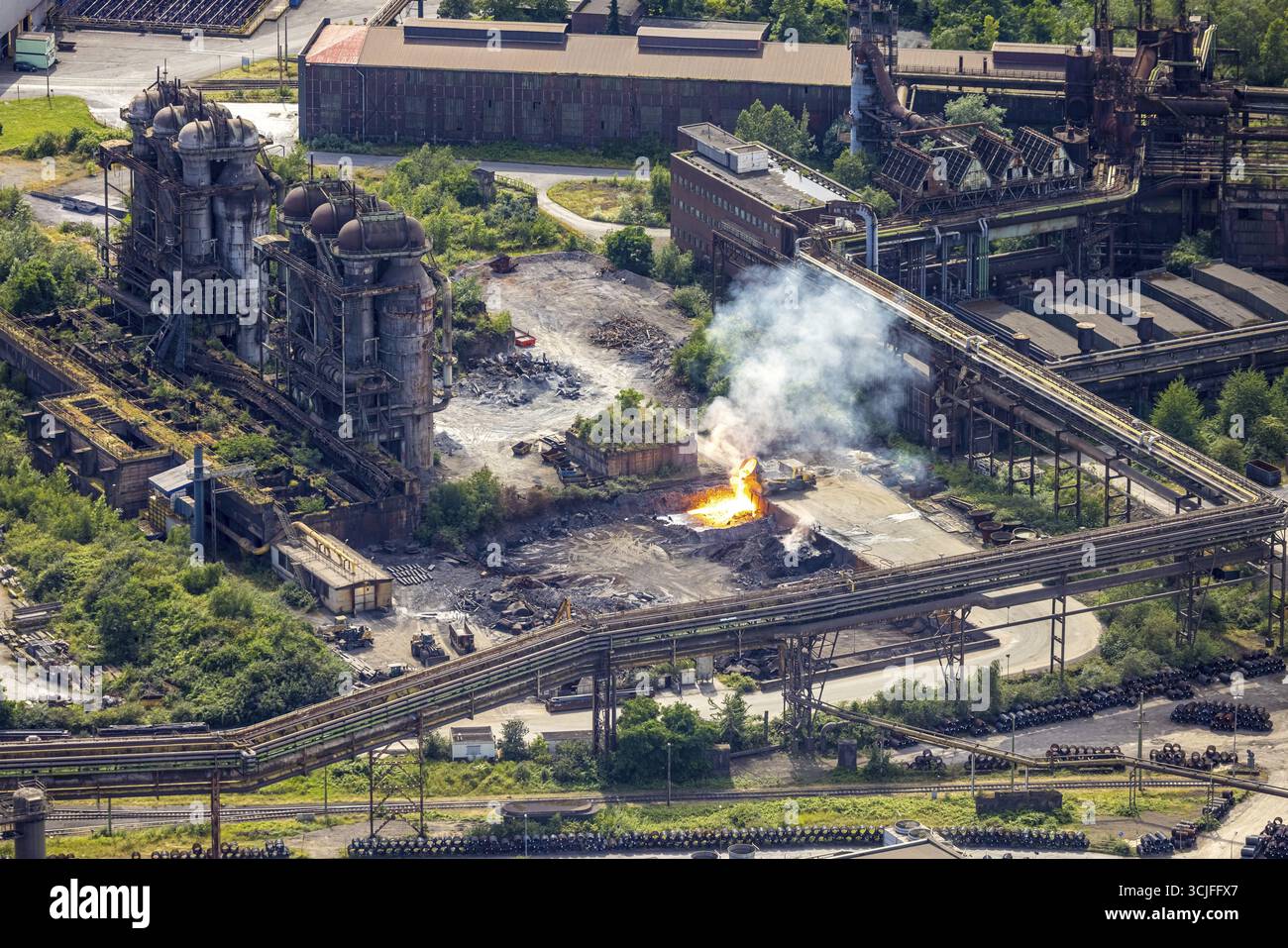 Aerial view, Duisburg-Nord, dumping of red-hot material with a lorry at ...