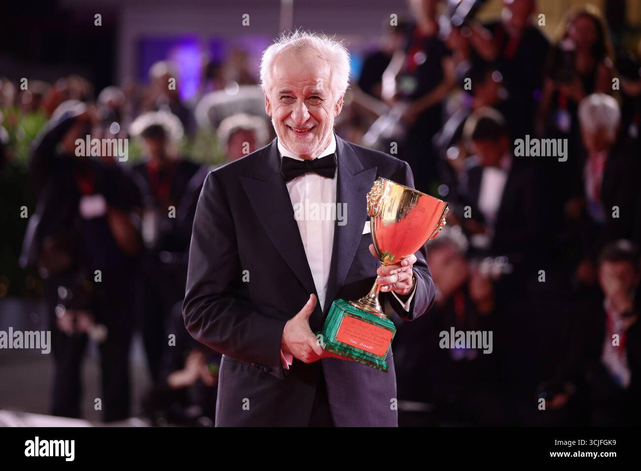 Toni Servillo holds the Coppa Volpi for Best Actor for “La Grazia ...