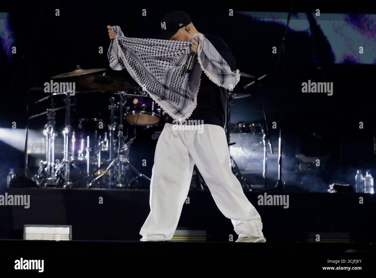 Puerto Rican rapper Residente wears a keffiyeh received from Nadya ...