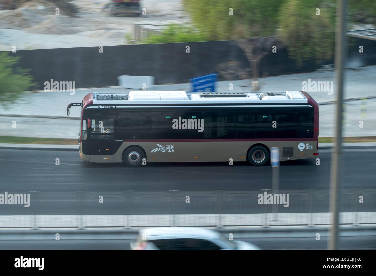Doha, Qatar - August 30, 2025: Karwa Metro link bus on Doha roads Stock ...