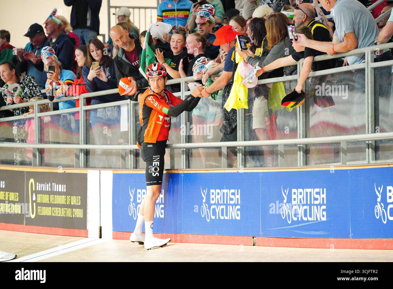 Geraint Thomas of INEOS Grenadiers interacts with spectators at the ...