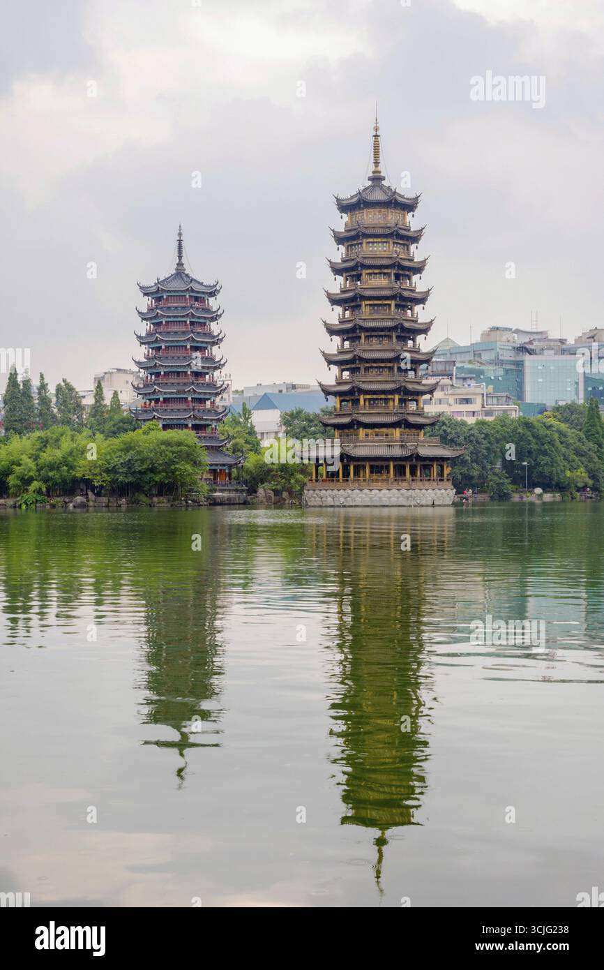 Two towers, pagodas of Sun and Moon by the lake. Top tourist attraction ...