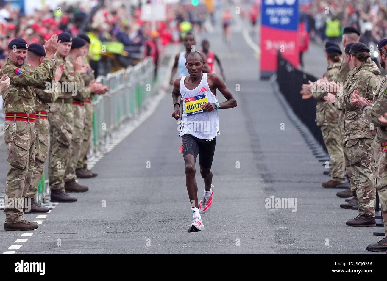 Alex Mutiso on his way to crossing the finish line in first place to ...