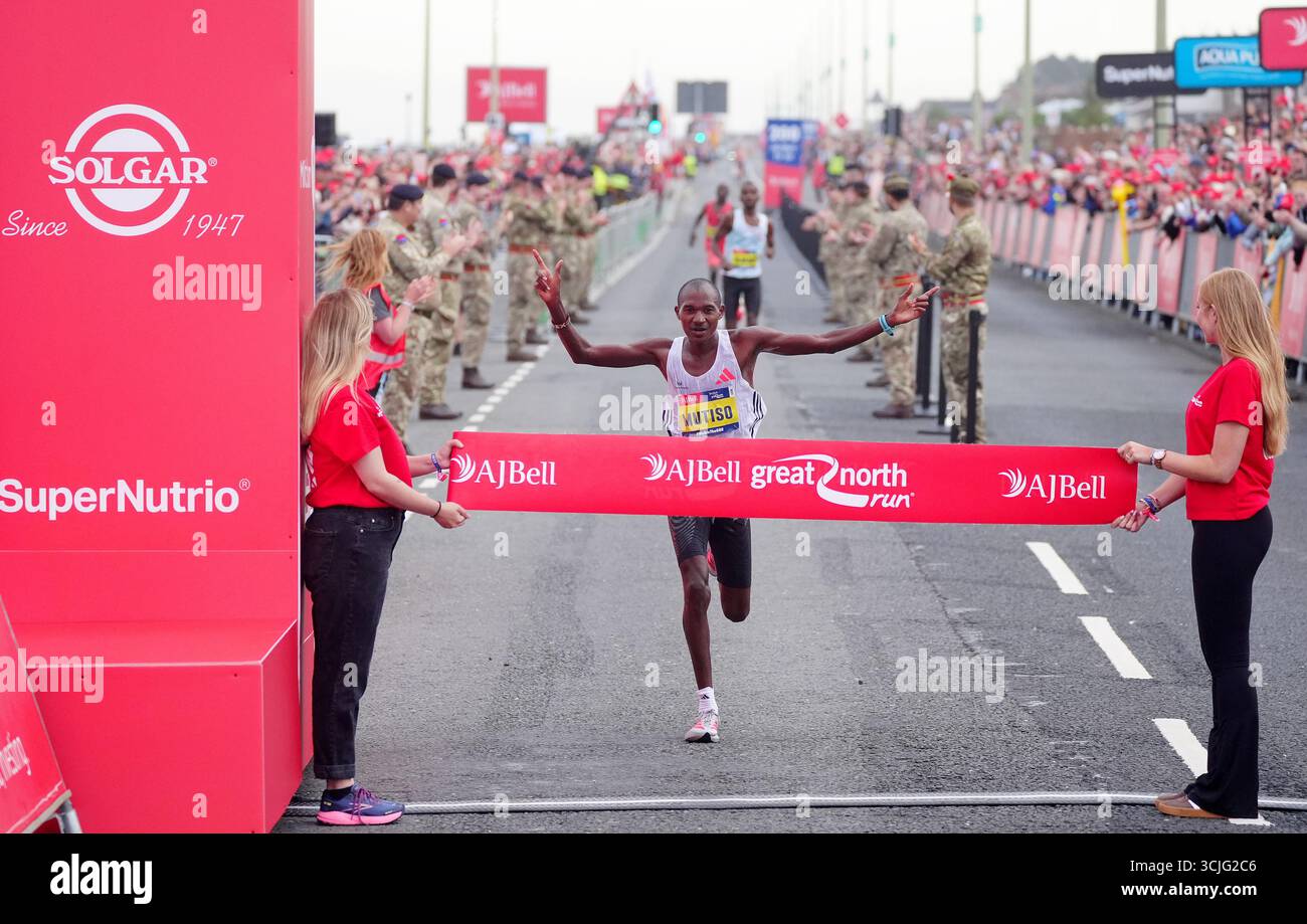 Alex Mutiso crosses the finish line in first place to win the Elite ...