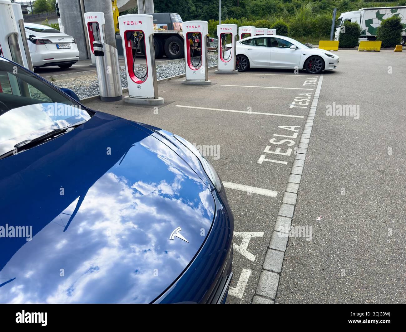 Tesla Super Charger power station at a highway rest stop petrol station ...