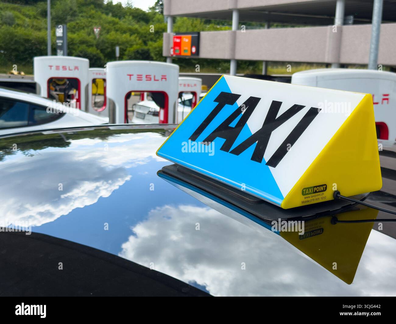 Tesla Super Charger power station at a highway rest stop petrol station ...