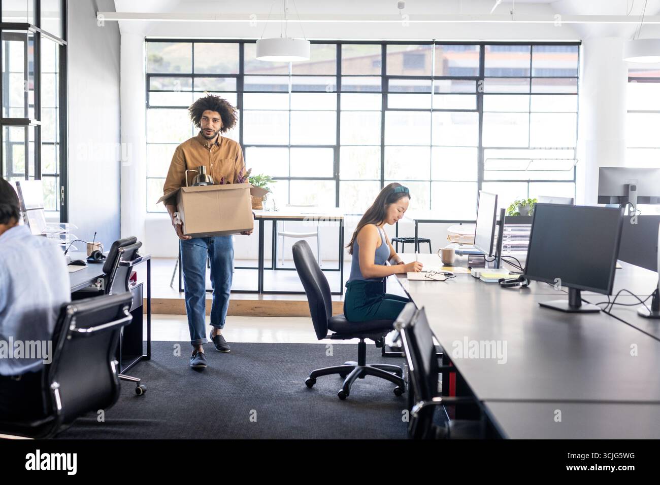 Asian woman entering carrying box hi-res stock photography and images ...