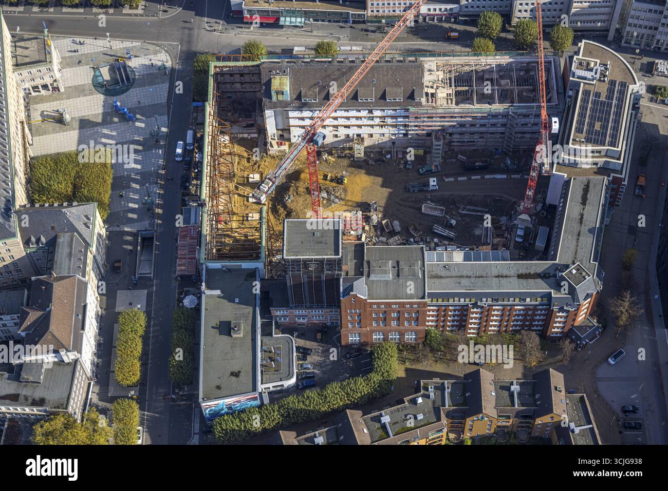 Aerial view, red brick building courtyard with construction site for ...