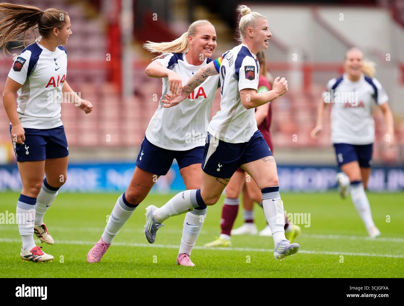Tottenham Hotspur's Bethany England (centre right) celebrates scoring ...