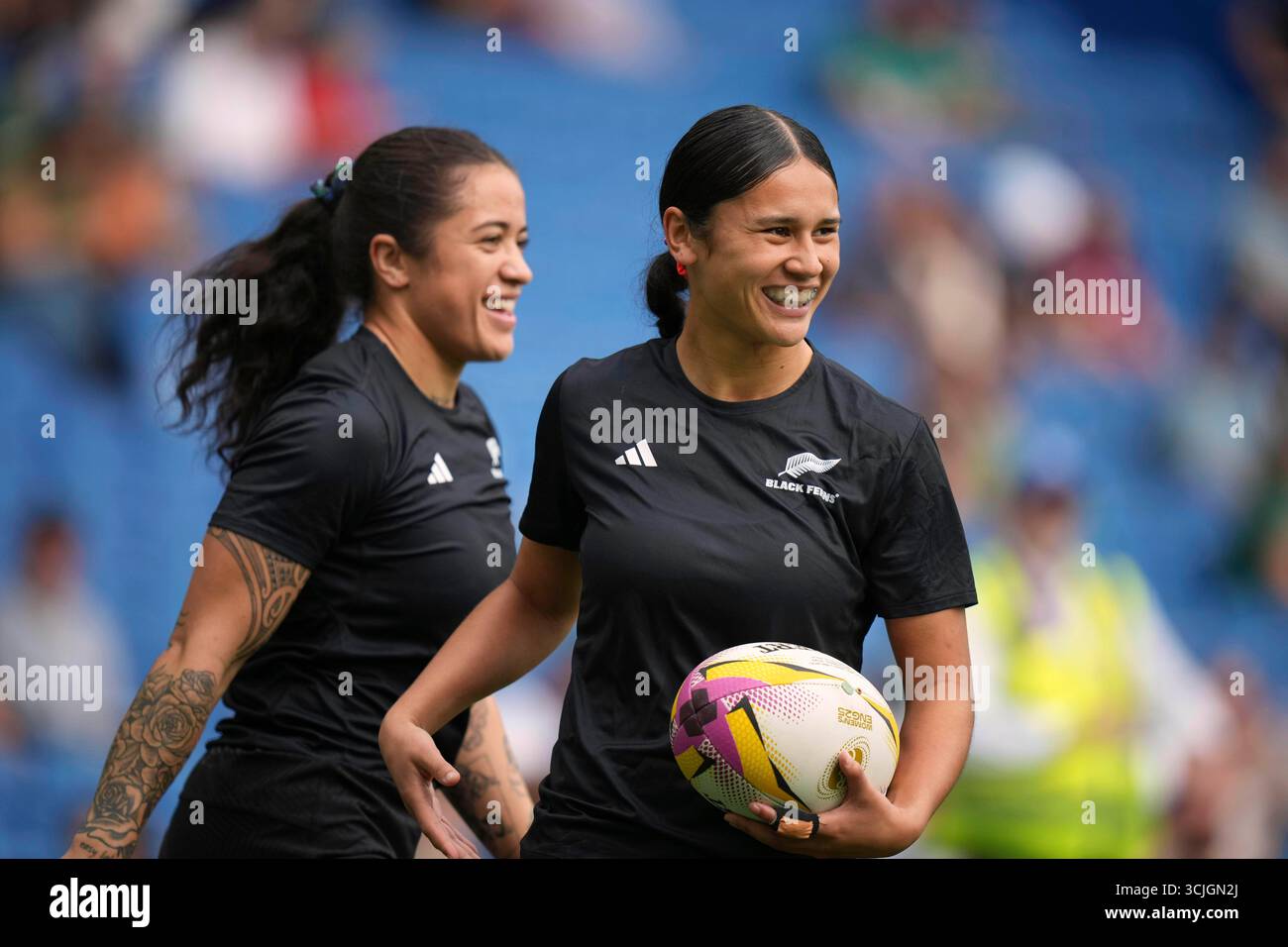 New Zealand's Renee Holmes, right, holds the ball ahead of the Women's ...