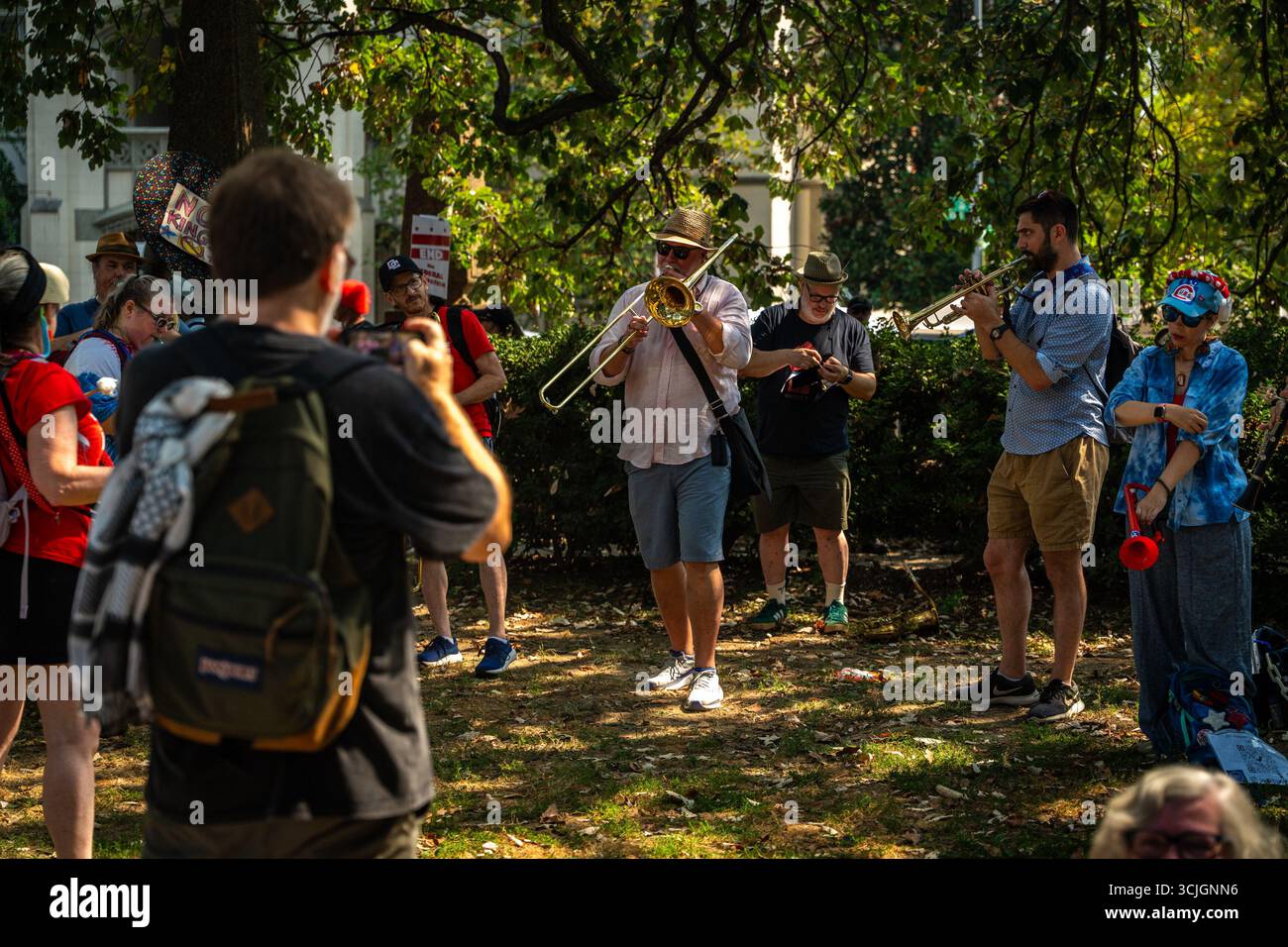 A marching band rallies protestors at Malcolm X Park in Washington, DC ...