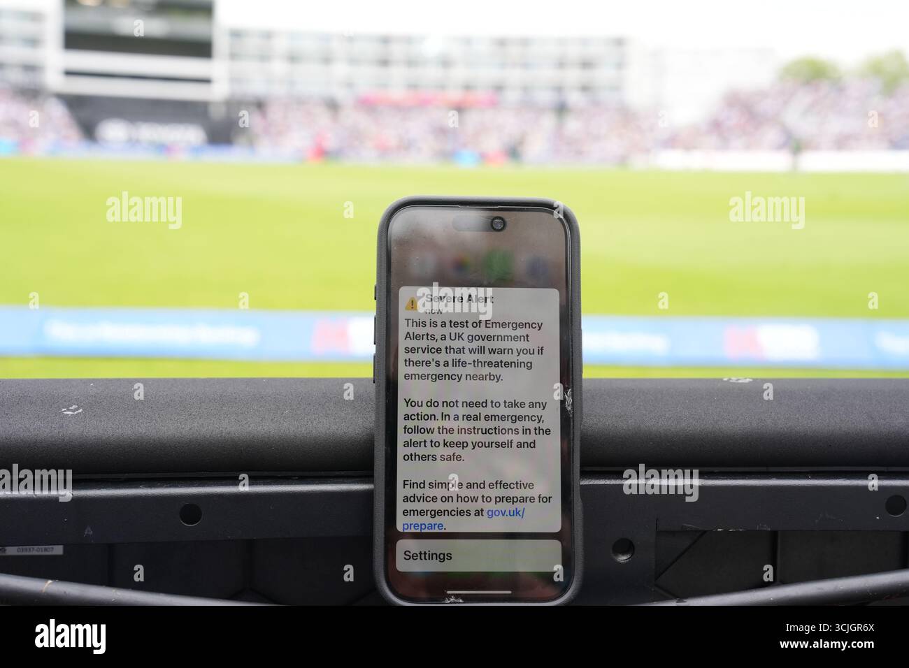 A test of a UK government public alert system on a mobile phone during ...