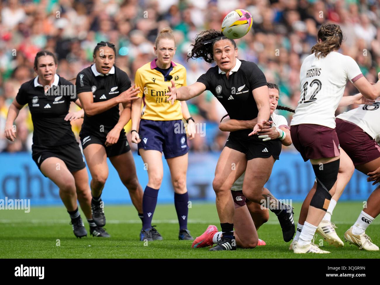 New Zealand's Portia Woodman-Wickliffe offloads the ball as she is ...