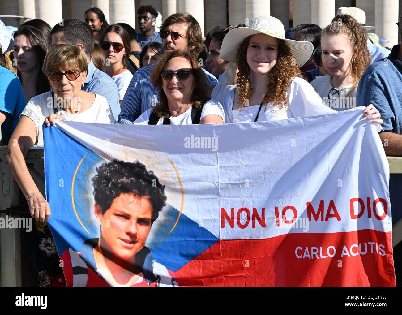 Pilgrims show the portrait of new saint Carlo Acutis as Pope Leo XIV ...