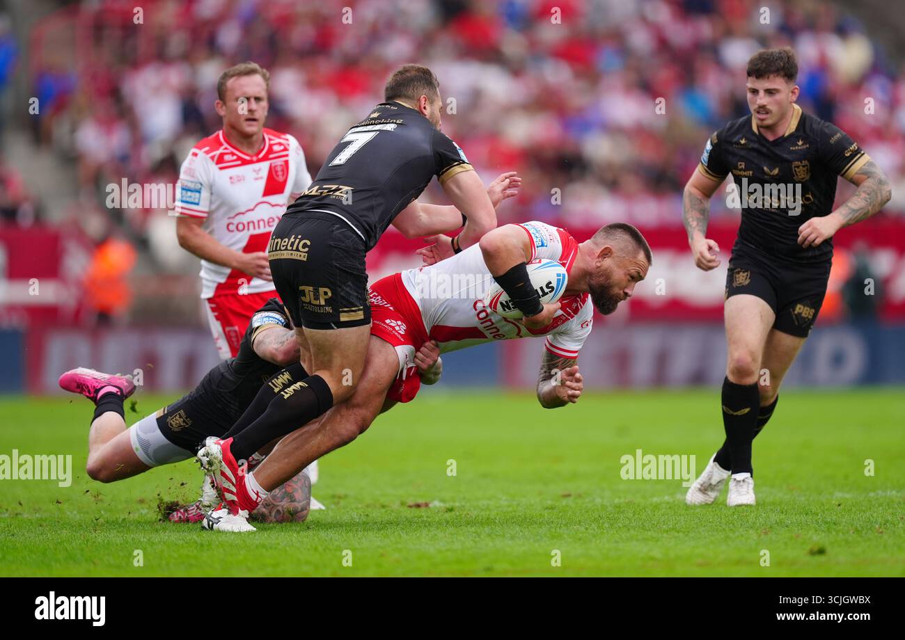 Hull KR's Jared Waerea-Hargreaves is tackled by Hull FC's Zak Hardaker ...