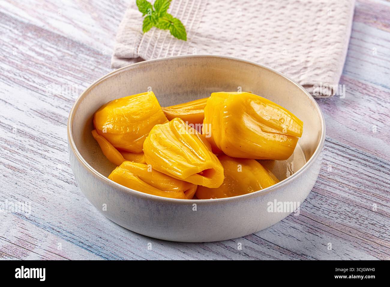 Canned sweet juicy yellow Jackfruit segment Stock Photo - Alamy