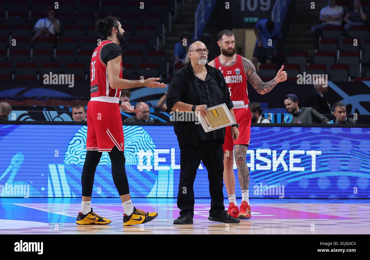 Georgia's head coach Aleksandar Dzikic (C) Goga Bitadze and Alexander ...