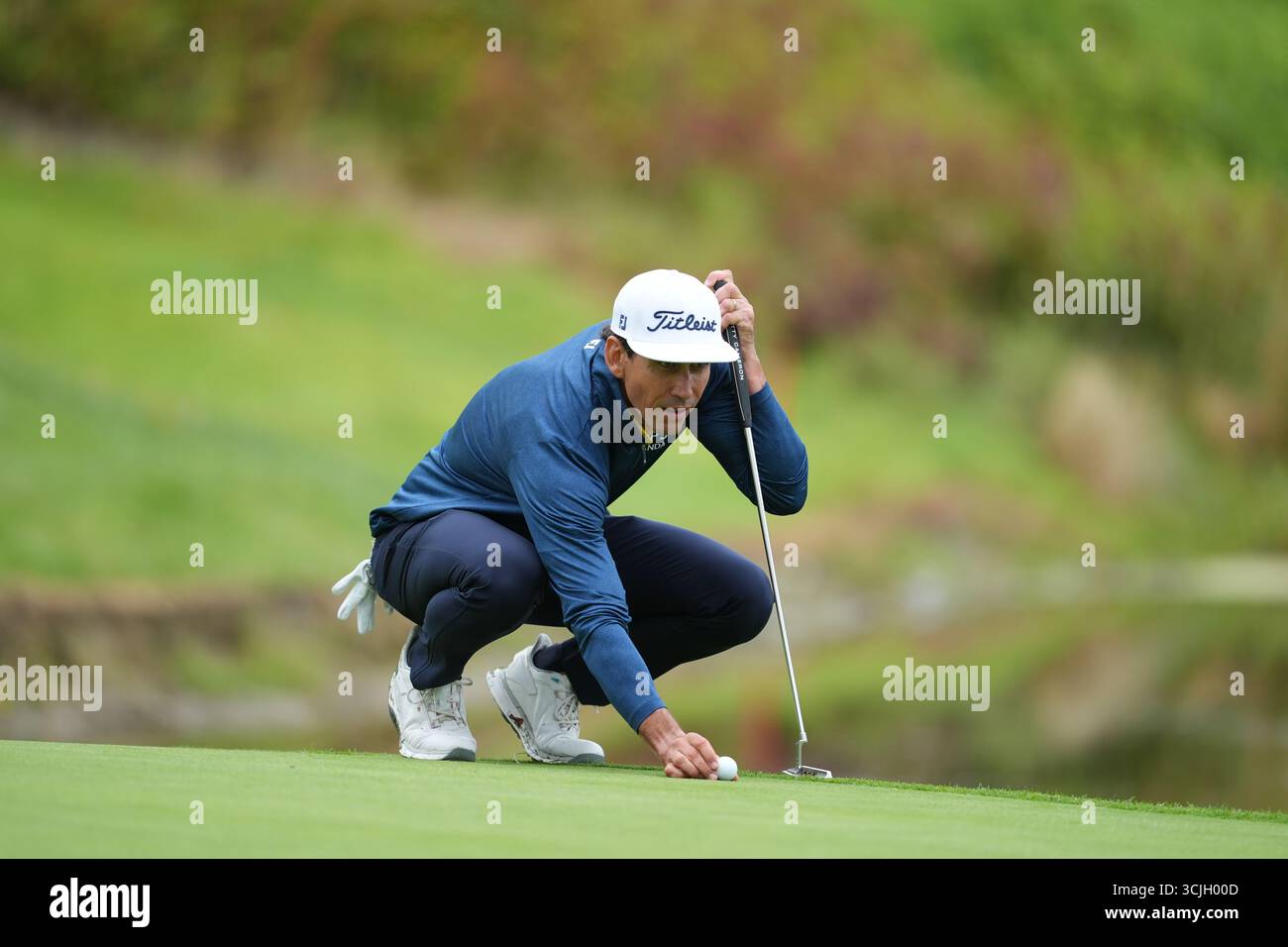 Rafa Cabrera Bello lines up a putt on the 11th green on day four of the ...