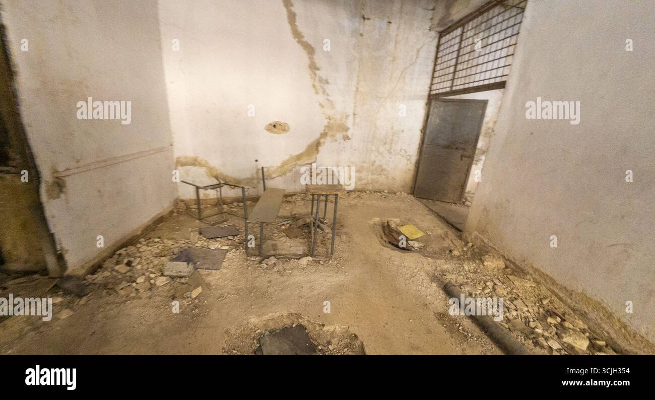 Abandoned, dilapidated room with broken furniture and debris. Syria ...